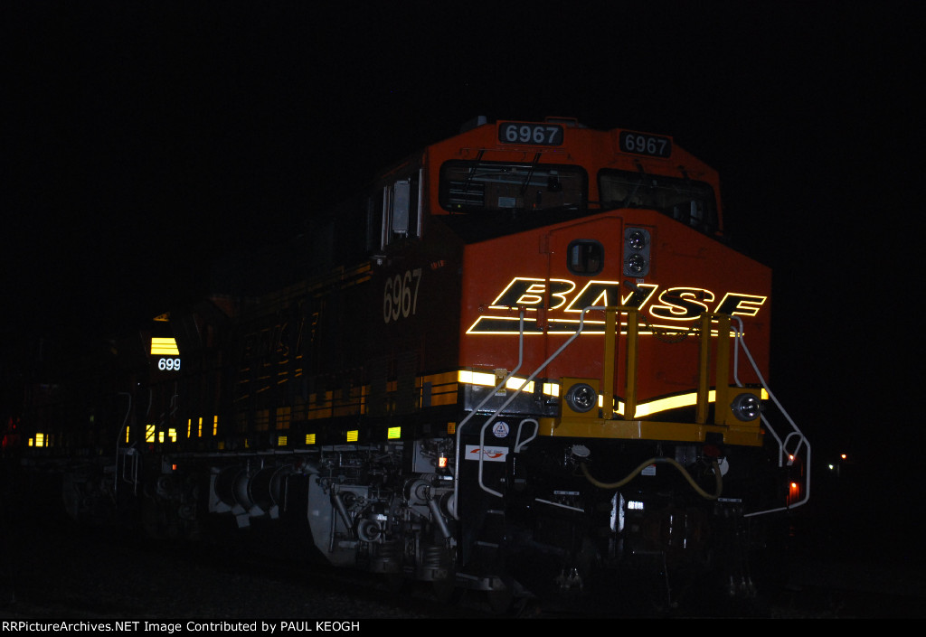 BNSF 6967 and BNSF 6991 light Up their BNSF Swoosh Reflective Logo Paint Job as they sit.